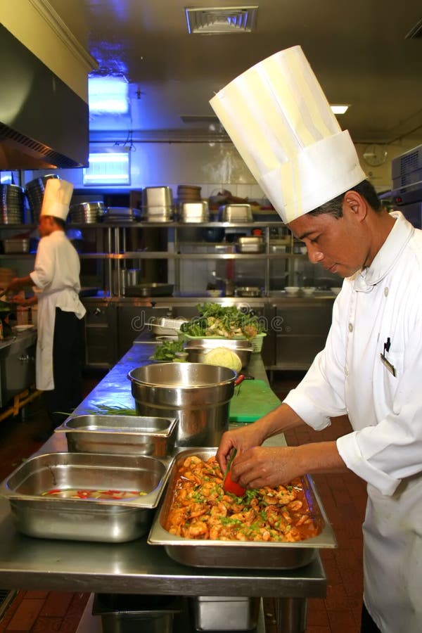 Chef cooking at kitchen stock image. Image of hotel, travel - 5470287