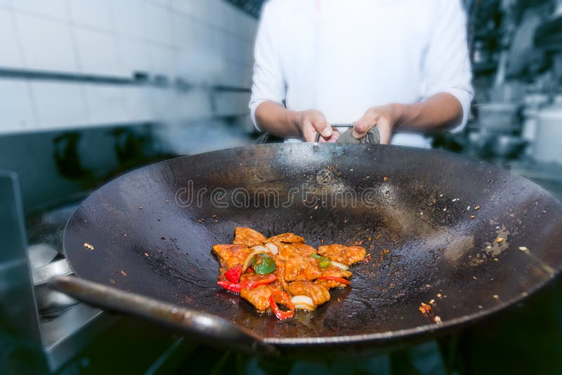 Chef cooking in kitchen stock image. Image of food, closeup - 79074147