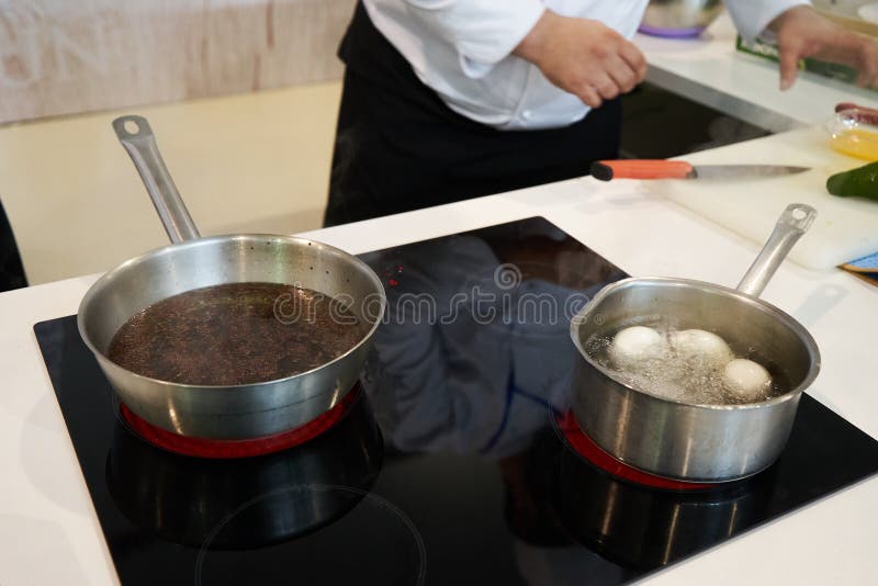 Chef Cooking in Kitchen, Chef Preparing Food Using Frying Pan on a ...