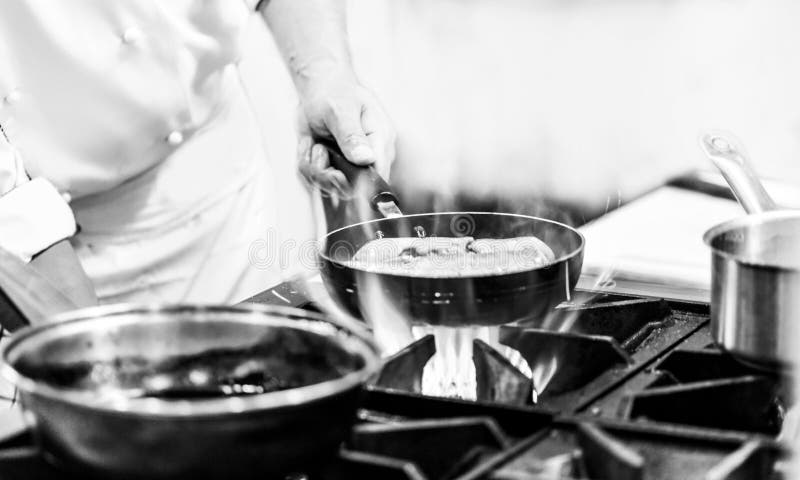 Chef Cooking in a Kitchen, Chef at Work, Black and White Stock Image ...