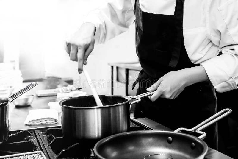 Chef Cooking in a Kitchen, Chef at Work, Black and White Stock Image ...