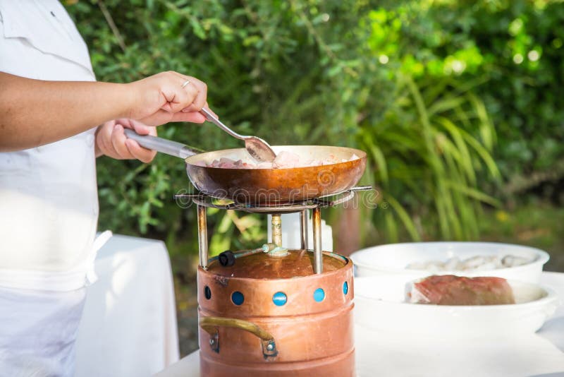 Chef cooking meat on grill stock photo. Image of catering - 88105496