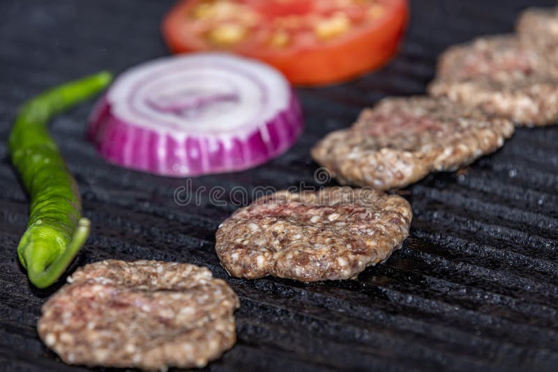 Chef is Cooking Meatballs on the Grill. Cut the Meatballs into Pieces ...