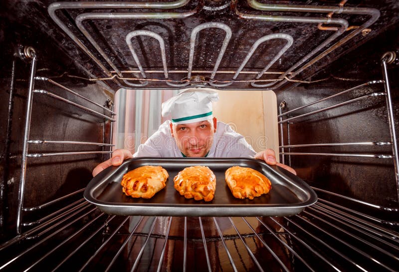 Chef cooking in the oven. stock image. Image of baking - 54142757