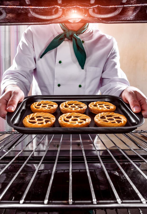 Chef cooking in the oven. stock image. Image of cake - 59668185