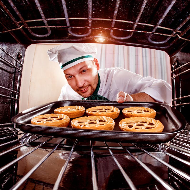 Chef cooking in the oven. stock photo. Image of food - 64756538