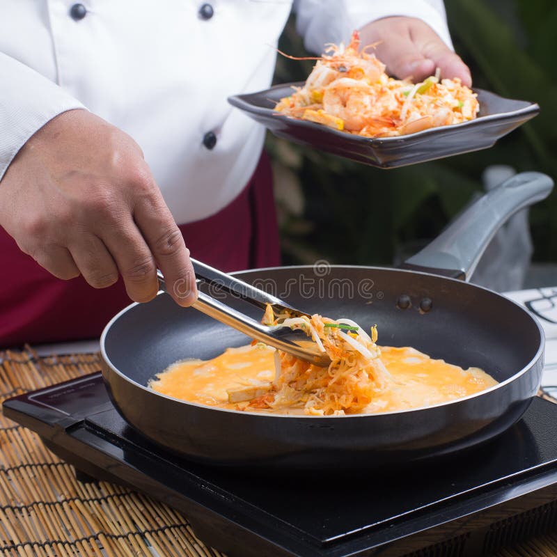 Chef cooking Pad Thai stock photo. Image of green, leek - 75485116