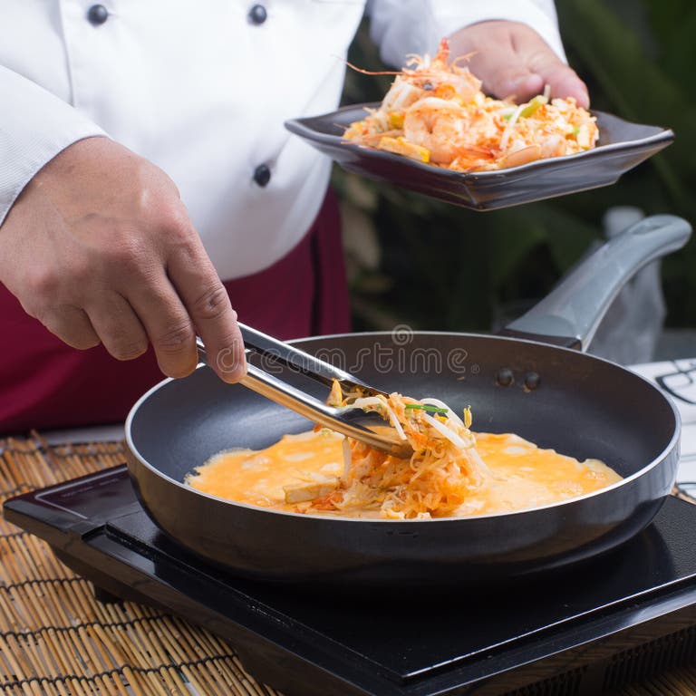 Chef cooking Pad Thai stock photo. Image of green, leek - 75485116