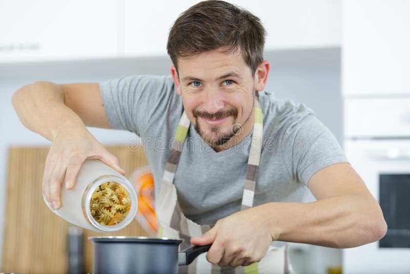 Chef cooking pasta stock photo. Image of adult, cook - 240329924