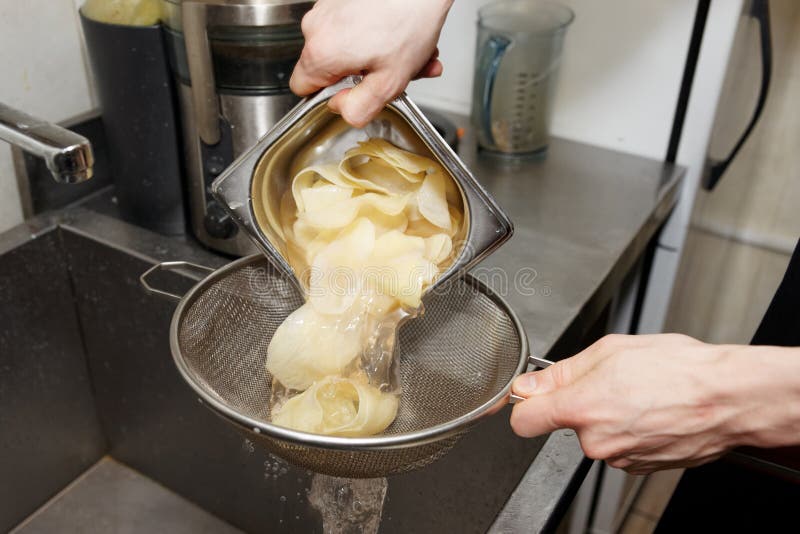 Chef is cooking potatoes stock photo. Image of plate - 39678548