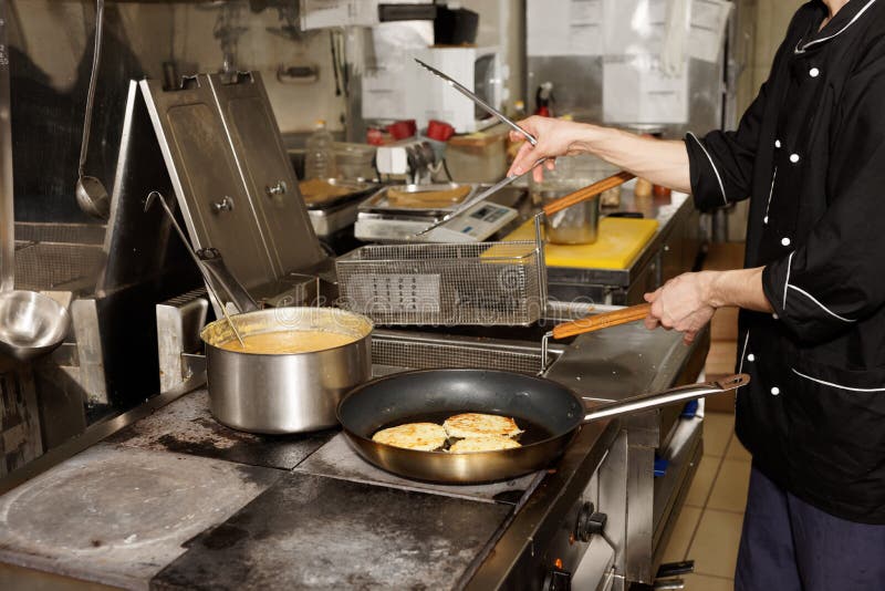 Chef is Cooking at Professional Kutchen Stock Image - Image of chef ...
