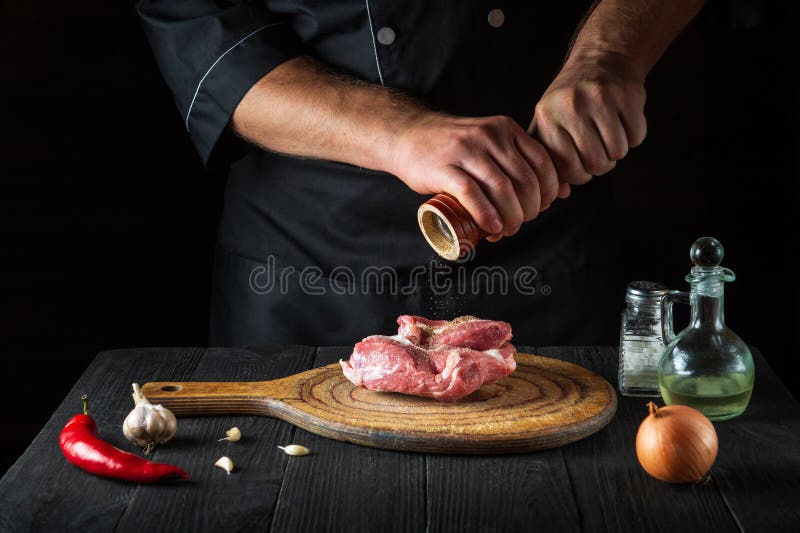 Chef Cooking Raw Meat Fillet and Adding Pepper or Chili for Marinade ...