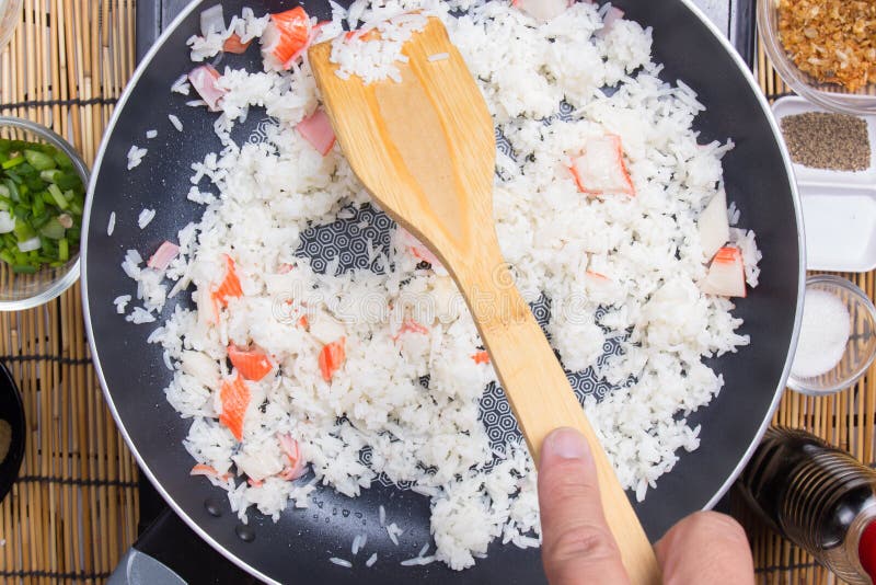 Chef cooking rice in pan stock photo. Image of recipe - 83431874