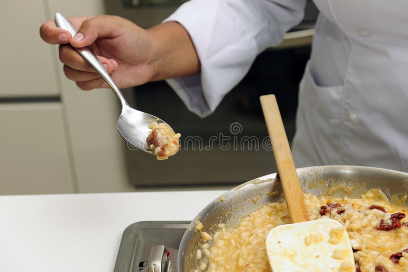 Chef cooking risotto stock photo. Image of cooking, female - 12958428