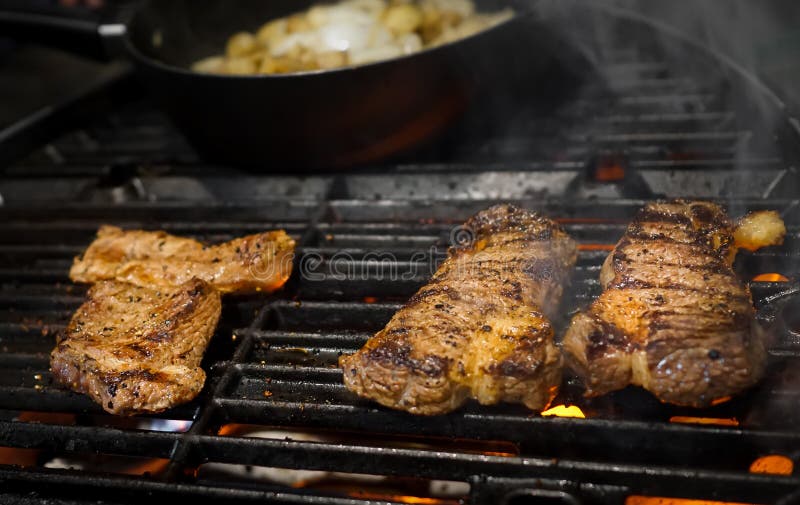 Chef Cooking Steak Beef on Black BBQ Grill. Stock Image - Image of ...