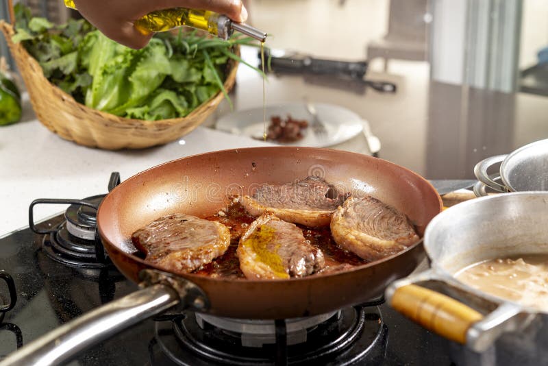 Chef Cooking Steaks on a Frying Pan in a Restaurant Kitchen Stock Image ...