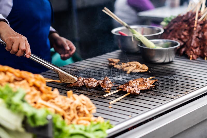 Chef cooking street food stock photo. Image of flame - 148343806