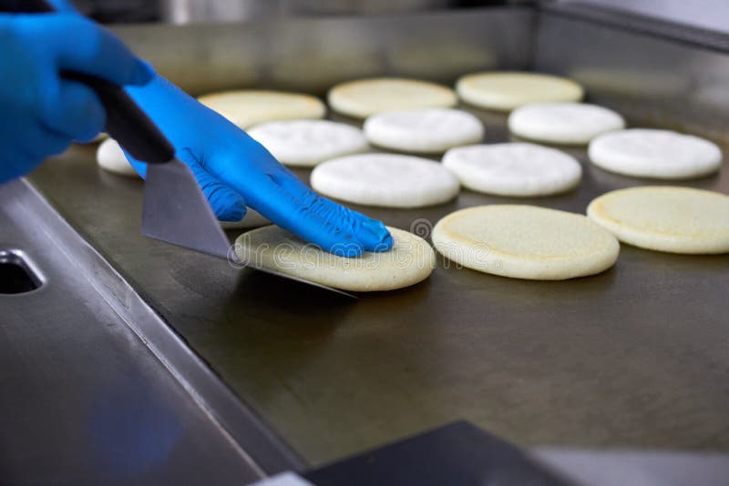 Chef Cooking Venezuelan Arepas Stock Photo - Image of material, style ...