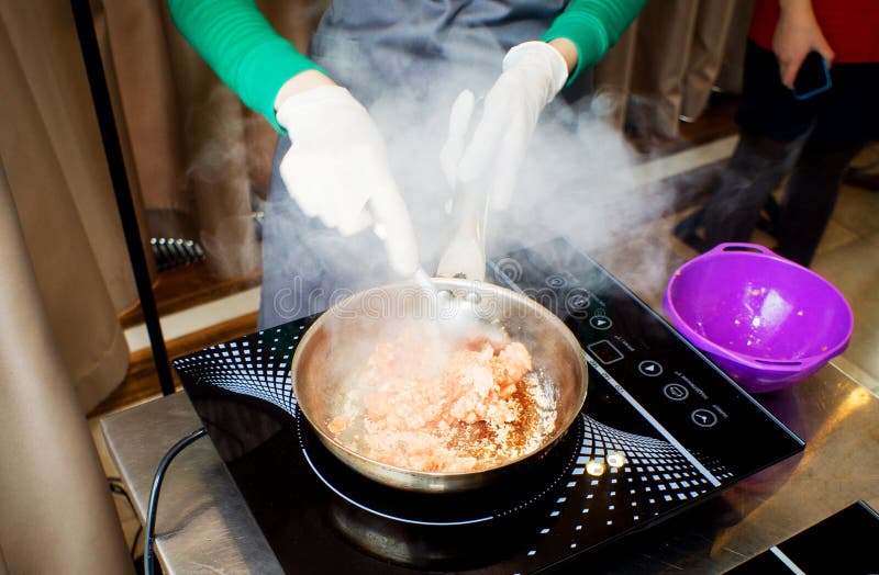 Chef cooks meat on the pan stock photo. Image of cooked - 65200658