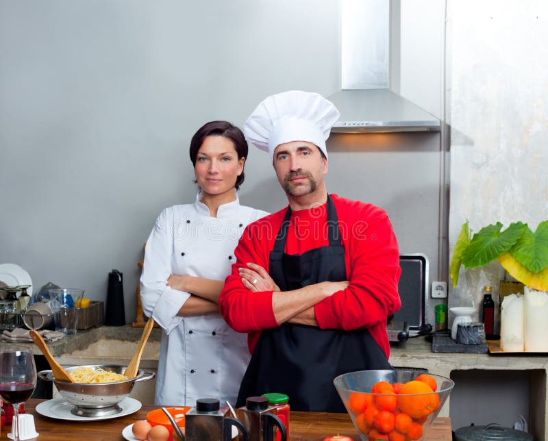 Chef Couple Man and Woman Posing in Kitchen Stock Image - Image of ...