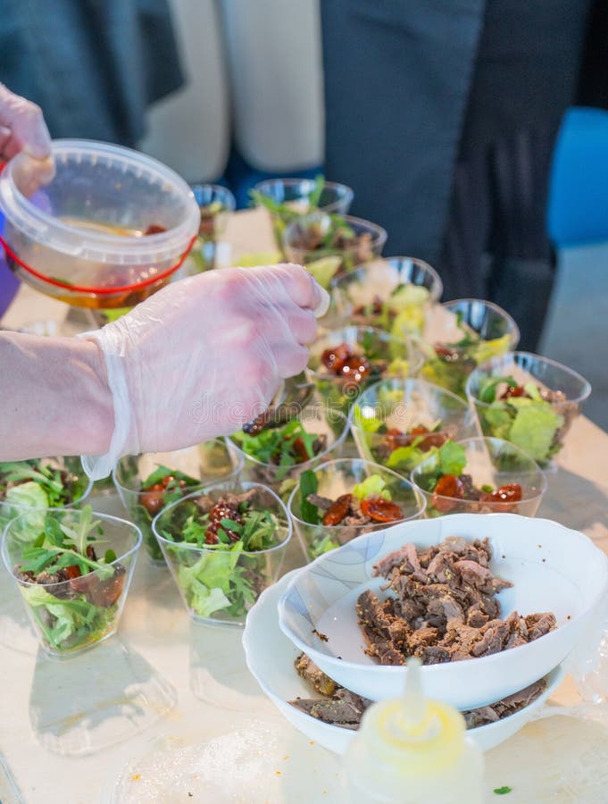 The Chef Covers the Table with a Variety of Snacks Stock Image - Image ...