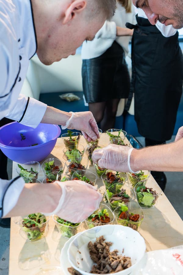 The Chef Covers the Table with a Variety of Snacks Stock Image - Image ...