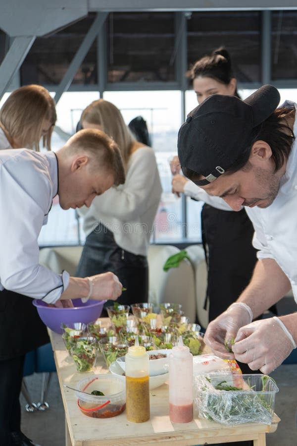 The Chef Covers the Table with a Variety of Snacks Stock Photo - Image ...