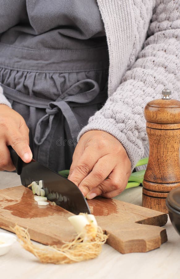 Chef Cut Spring Onion with Sharp Knife on Cutting Board Stock Photo ...