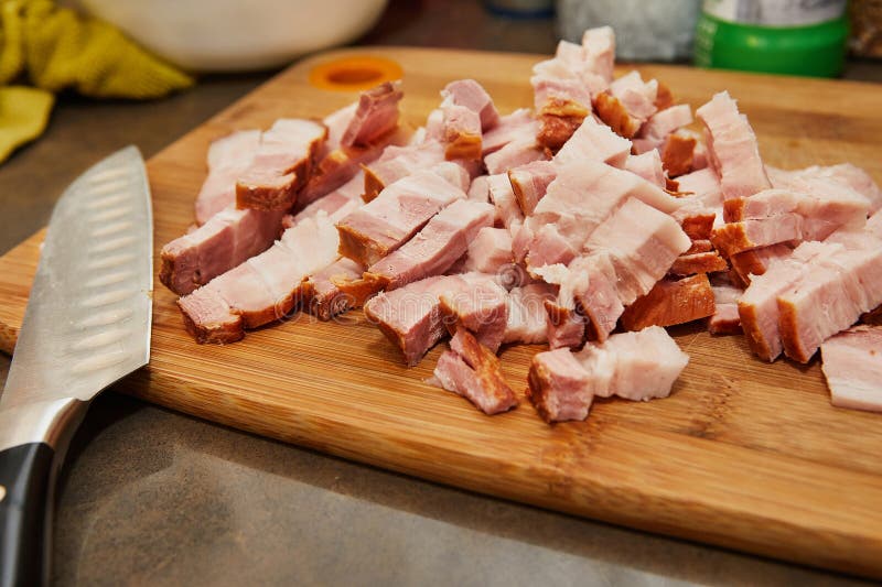 Chef Cuts Bacon in the Kitchen for Recipe Stock Photo - Image of ...