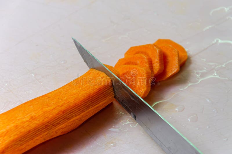 The Chef Cuts a Carrot with a Knife Stock Photo - Image of fibre, root ...
