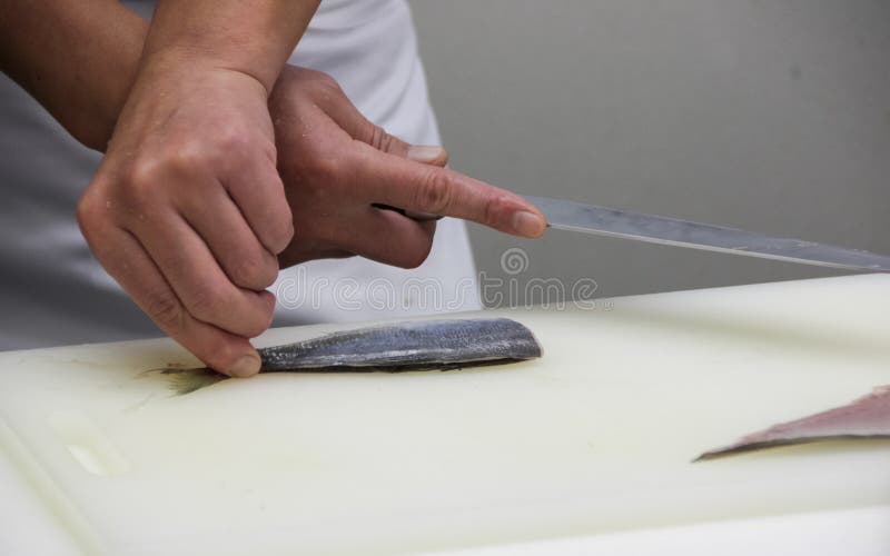 Chef Cuts the Fish into Pieces of Sushi Stock Image - Image of hands ...