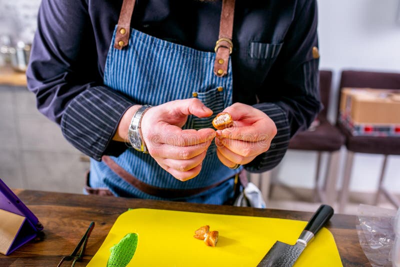 Chef Cuts Fried Fish in Batter. Master Class in the Kitchen. the ...