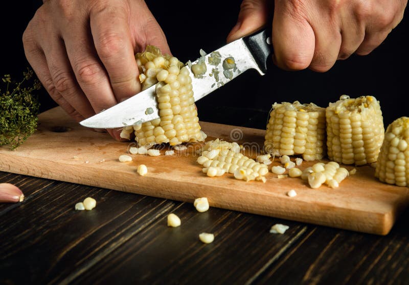 Chef Cuts the Grains of Boiled Corn with a Knife. Maize is an Excellent ...