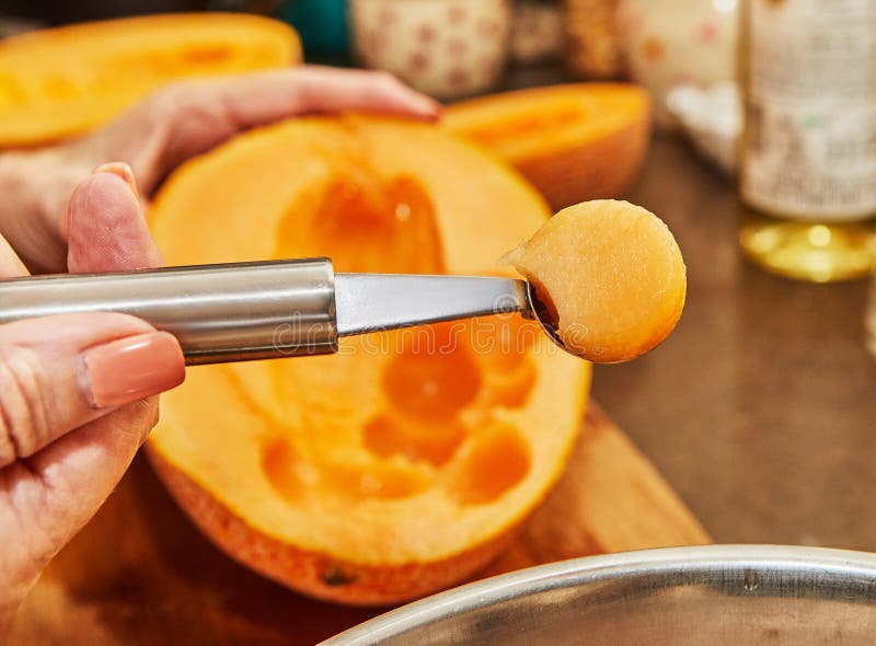 Chef Cuts Melon Balls with Special Spoon in Kitchen Stock Photo - Image ...