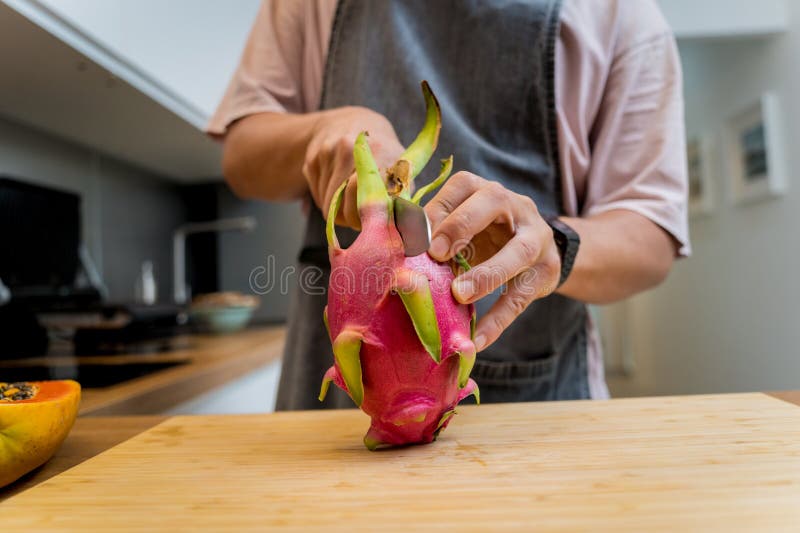 Chef Cuts and Peels Dragon Fruit on the Cutting Board Stock Photo ...