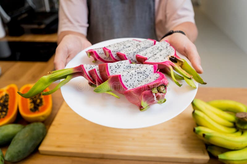 Chef Cuts and Peels Dragon Fruit on the Cutting Board Stock Photo ...