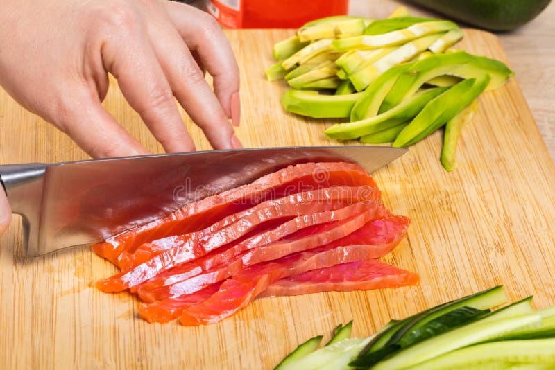 The Chef Cuts Red Fish with a Knife Stock Photo - Image of ingredients ...