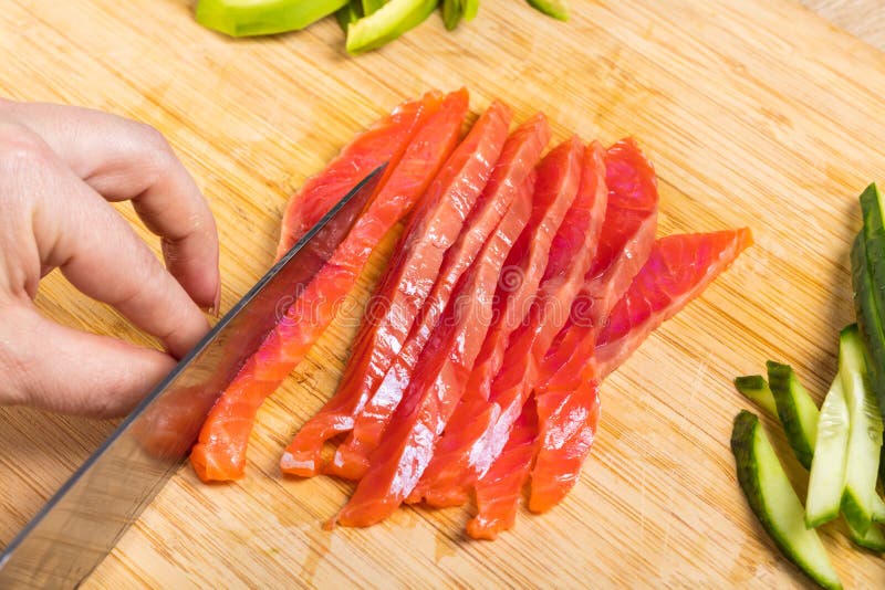 The Chef Cuts Red Fish with a Knife Stock Photo - Image of avocado ...