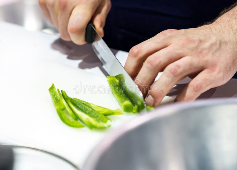 Chef Cuts the Vegetables Cooking in a Kitchen, Hands Slicing Vegetables ...