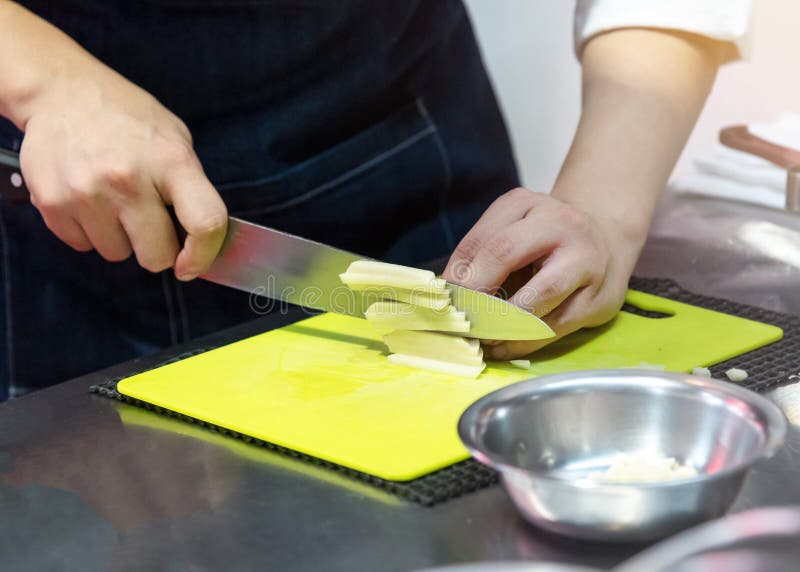 Chef Cuts the Vegetables Cooking in a Kitchen, Hands Slicing Vegetables ...
