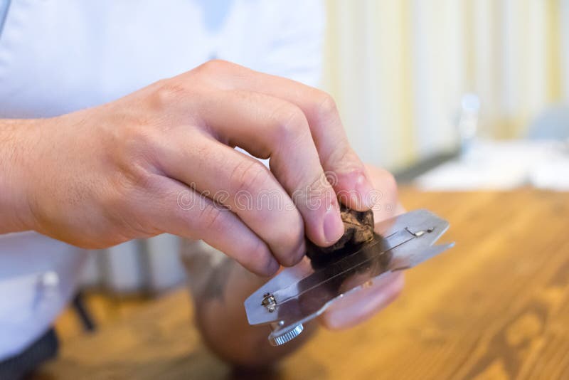 Chef cuts a white truffle stock photo. Image of homemade - 176441656