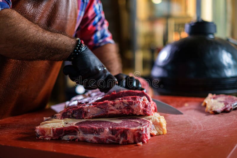 Chef Cutting Beef Steakes in a Restaurant Stock Photo - Image of ...