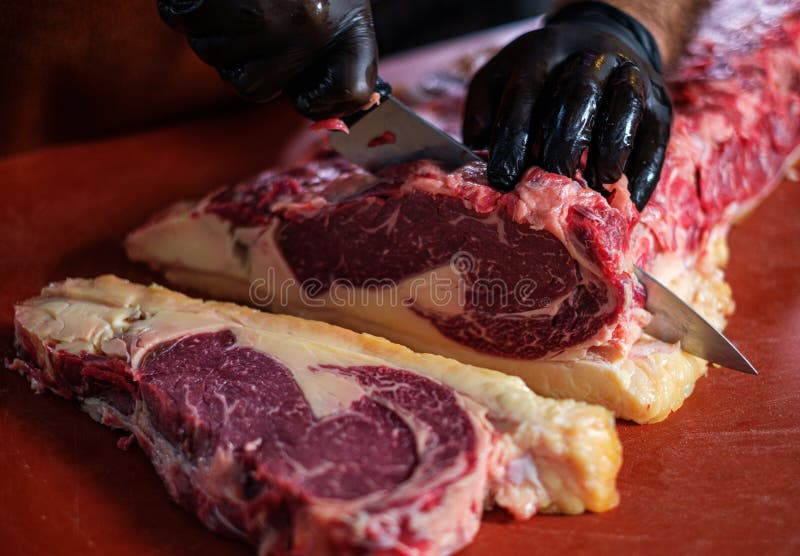 Chef Cutting Beef Steakes in a Restaurant Stock Photo - Image of ...