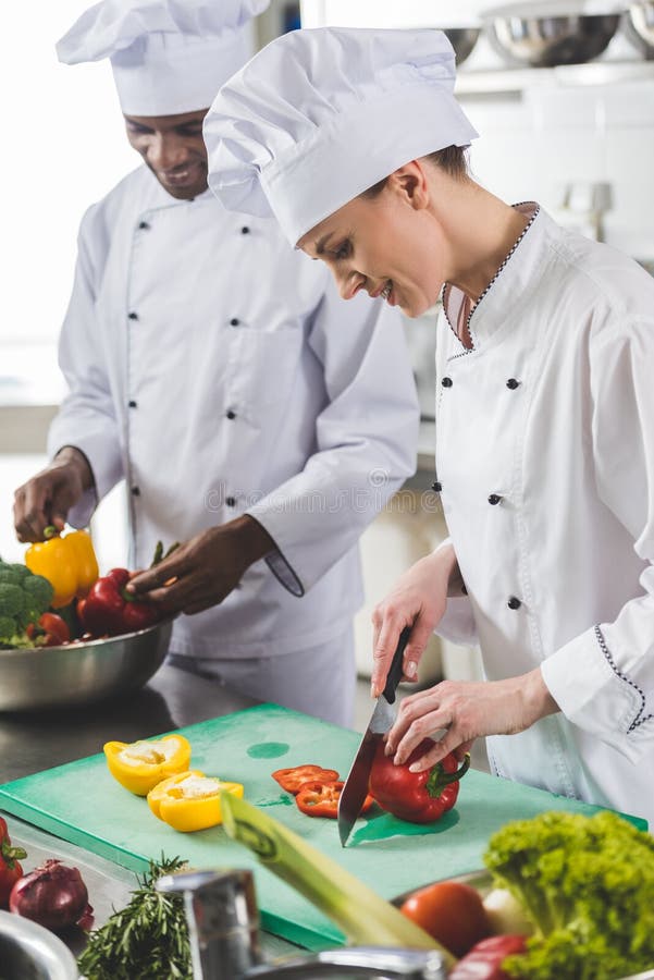 Chef cutting bell peppers stock image. Image of chefs - 129306871