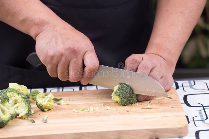 Chef Cutting Broccoli for Cooking Stock Image - Image of cook ...