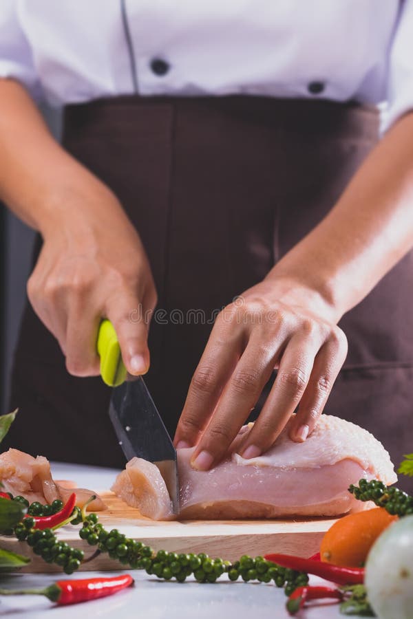 Chef cutting chicken stock photo. Image of service, culinary - 20758846