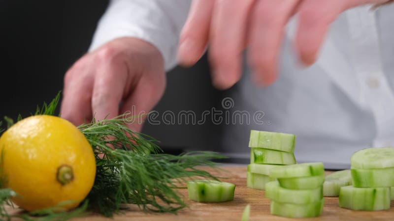 Chef cutting cucumber stock footage. Video of board - 253372990