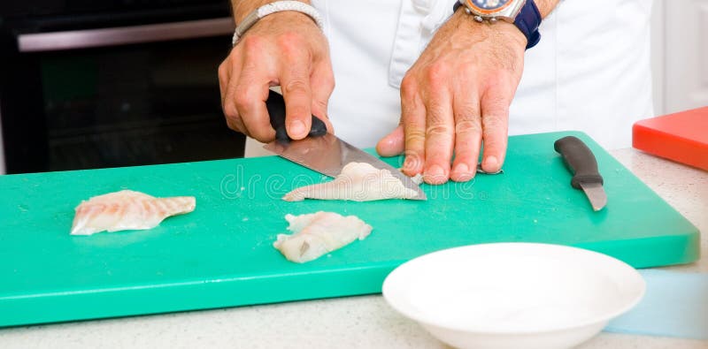 Chef cutting fish stock image. Image of chef, equipment - 23425991
