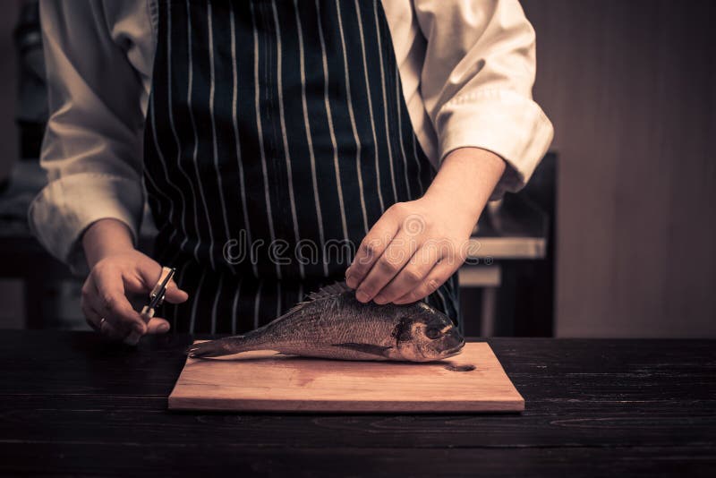 Chef Cutting the Fish on a Board Stock Photo - Image of butcher ...