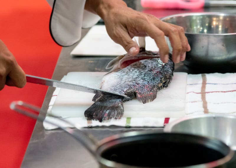 Chef Cutting Fish, Chef Slices Fish Fresh on Board in the Kitchen Stock ...